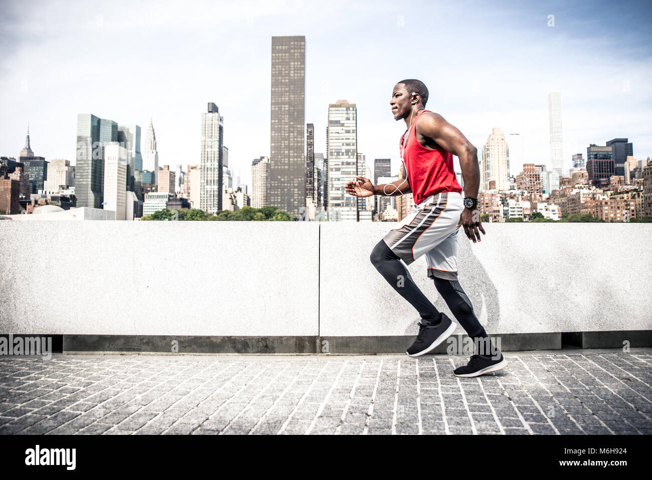 Runner running hard in New york city Stock Photo - Alamy