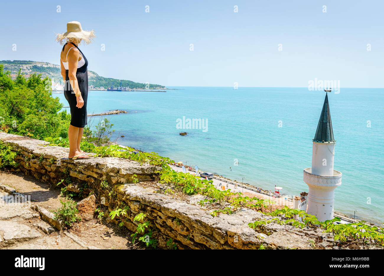 A woman is enjoying a view of Black Sea at the Balchik Palace gardens ...