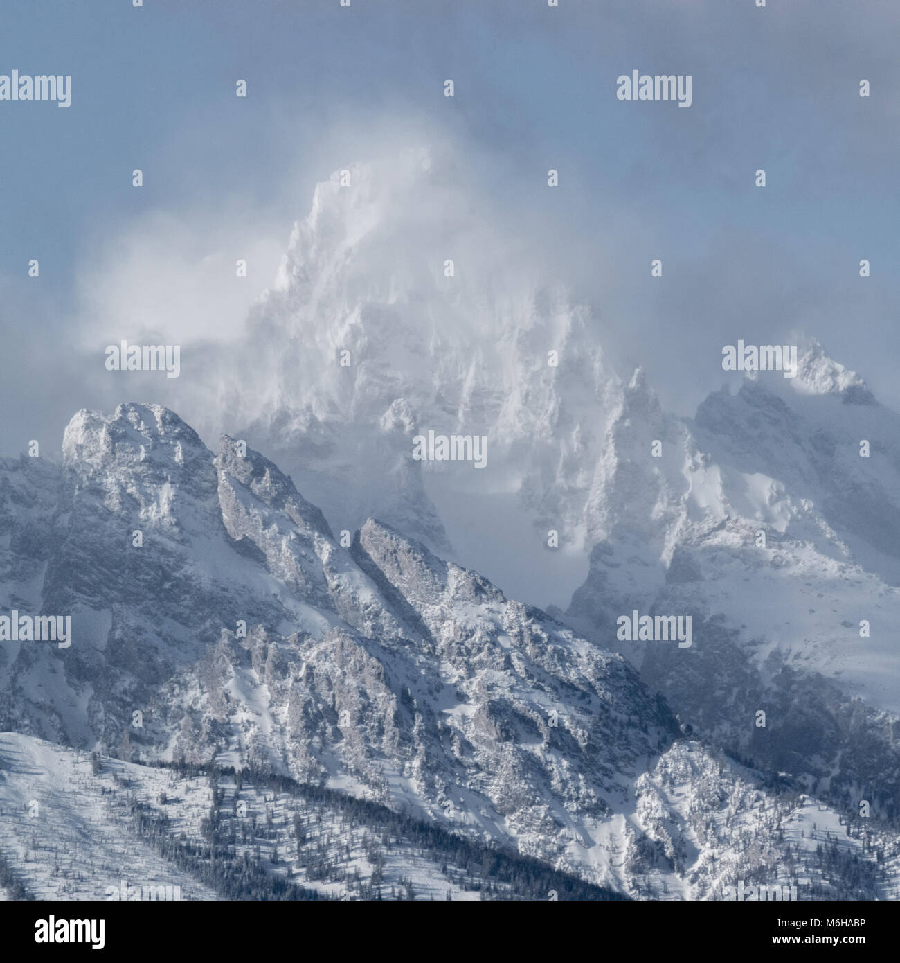 High altitude winds blow clouds of snow off Grand Teton Stock Photo - Alamy