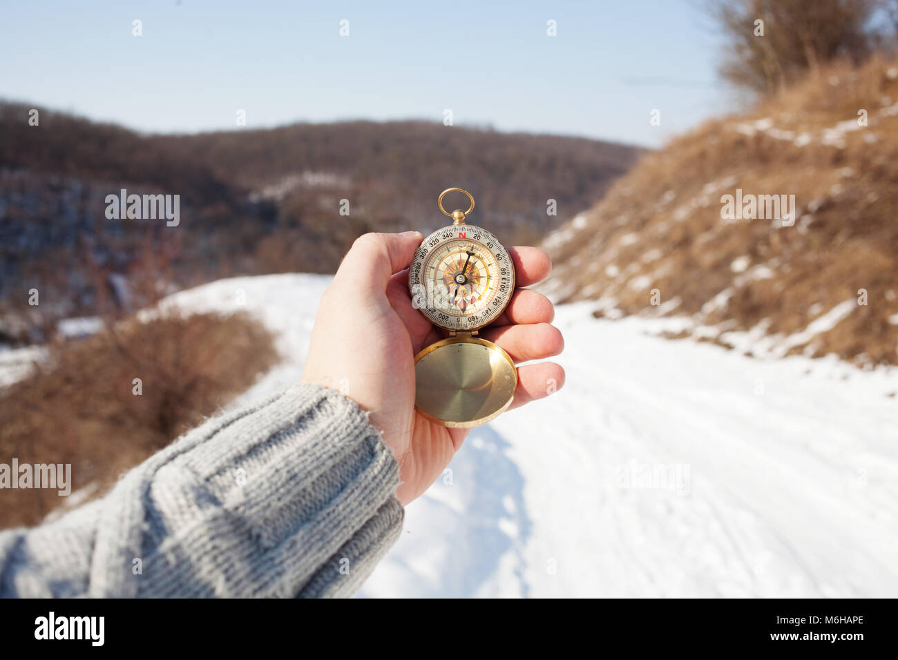 Hand holding a compass, winter time idea, searching direction Stock ...