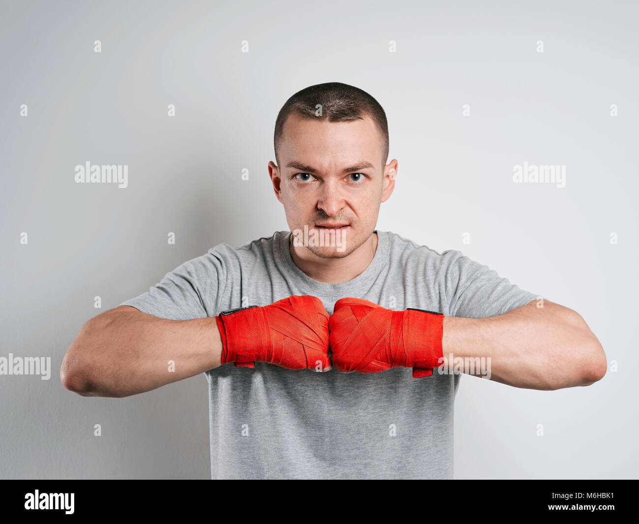 man in red Boxing bandages white background Stock Photo - Alamy