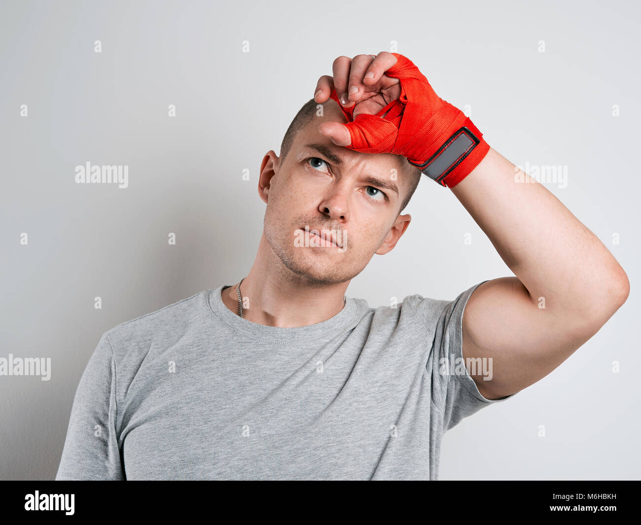 man in red Boxing bandages white background Stock Photo - Alamy