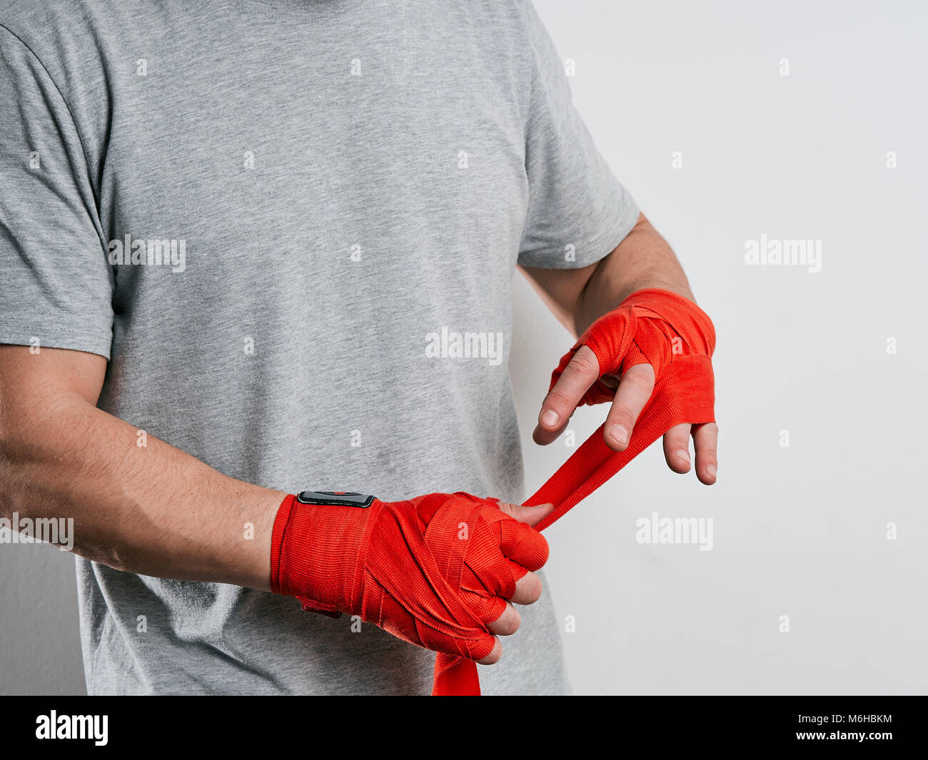 man in red Boxing bandages white background Stock Photo - Alamy