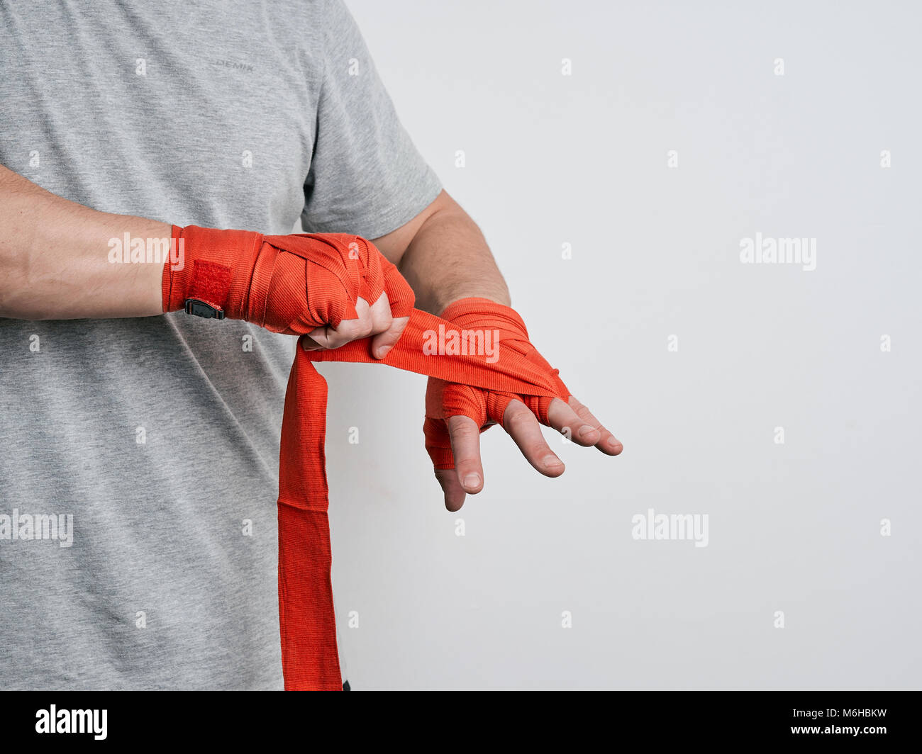 man in red Boxing bandages white background Stock Photo - Alamy