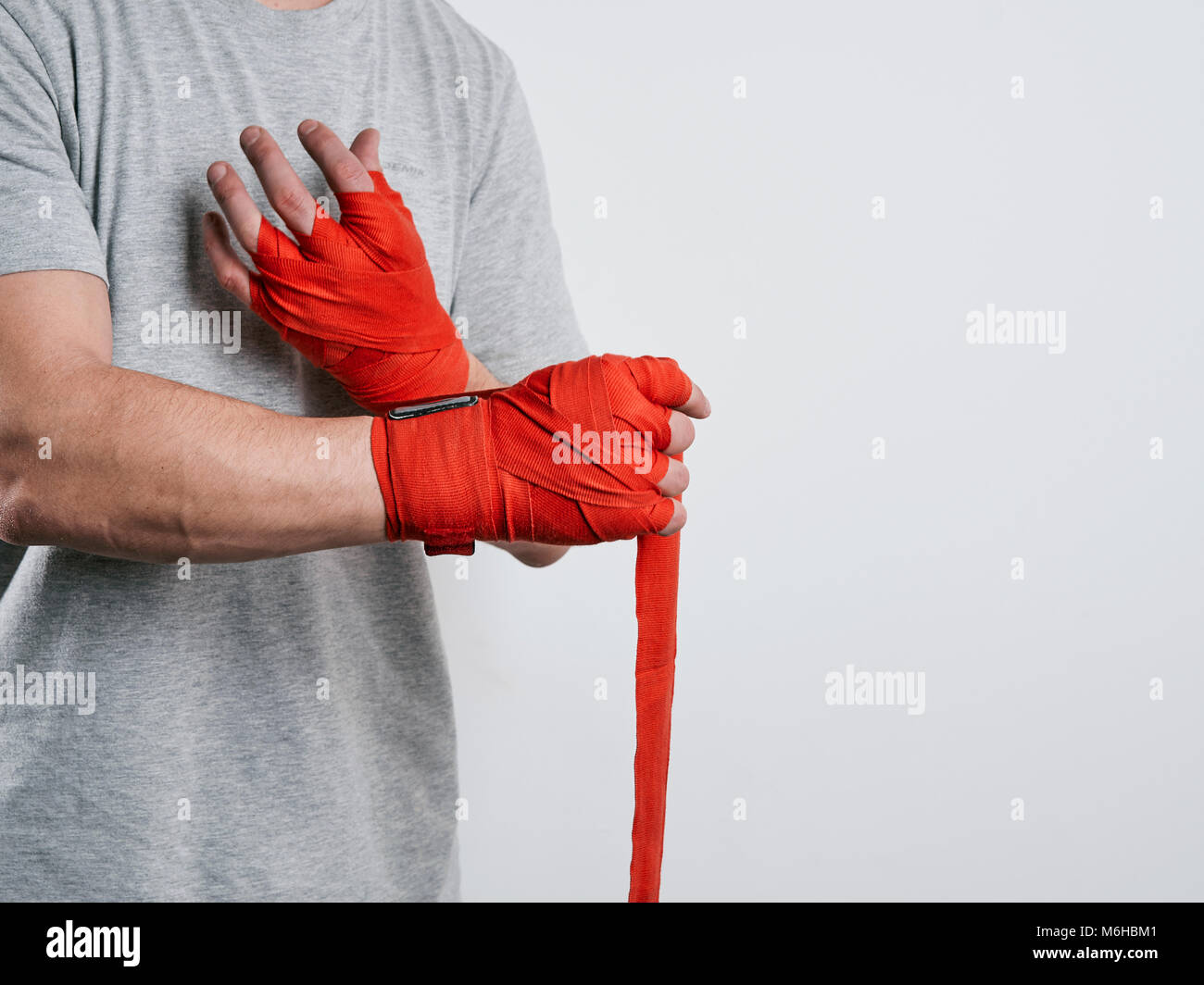 man in red Boxing bandages white background Stock Photo - Alamy