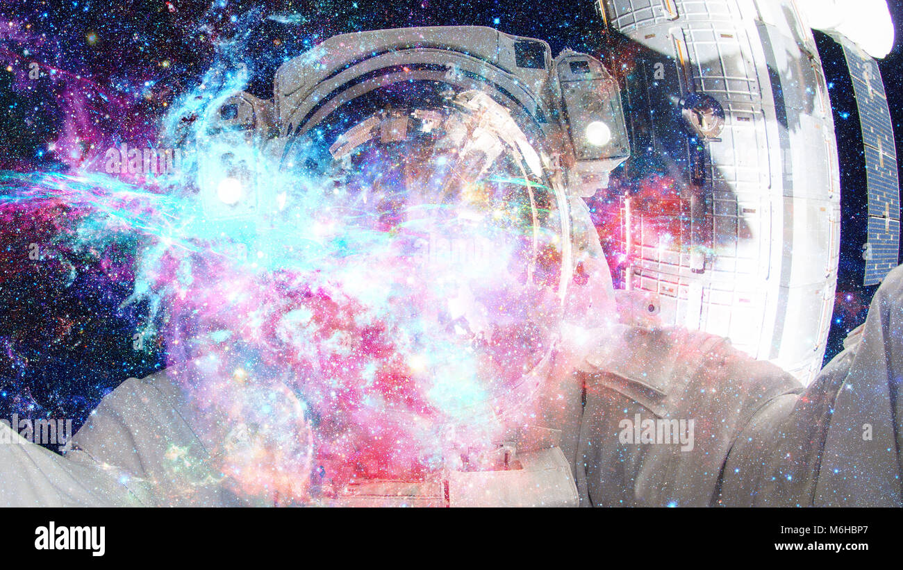 Astronaut in outer space. Science fiction art. Elements of this image ...