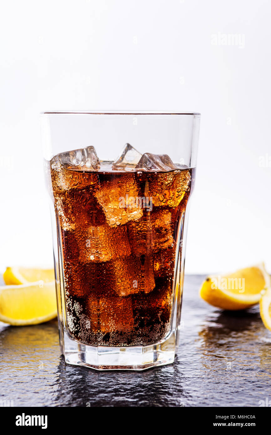 Cold cola drink with bubbles and ice cubes Stock Photo - Alamy