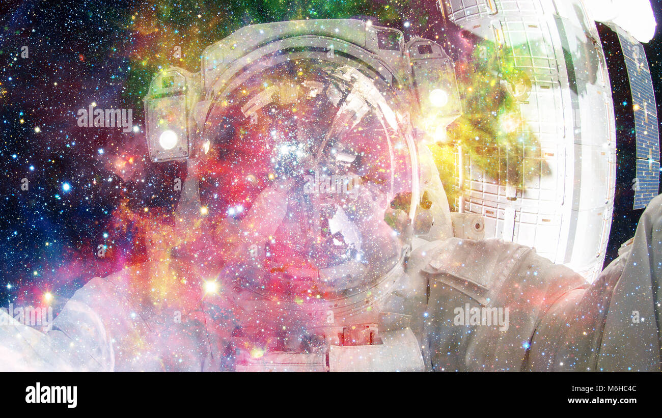 Astronaut in outer space. Science fiction art. Elements of this image ...