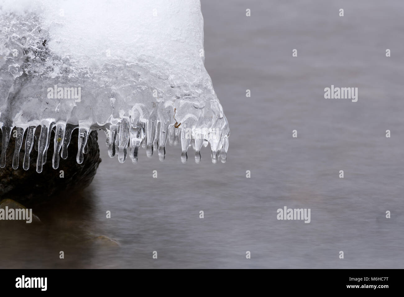 Ice build up on the rocks Stock Photo - Alamy