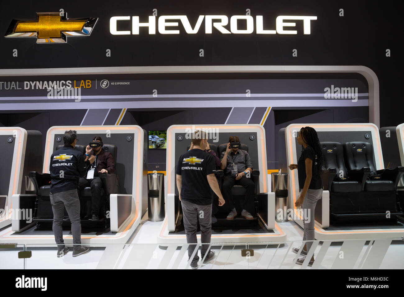 People immersed in a virtual reality simulation at Chevrolet technology ...