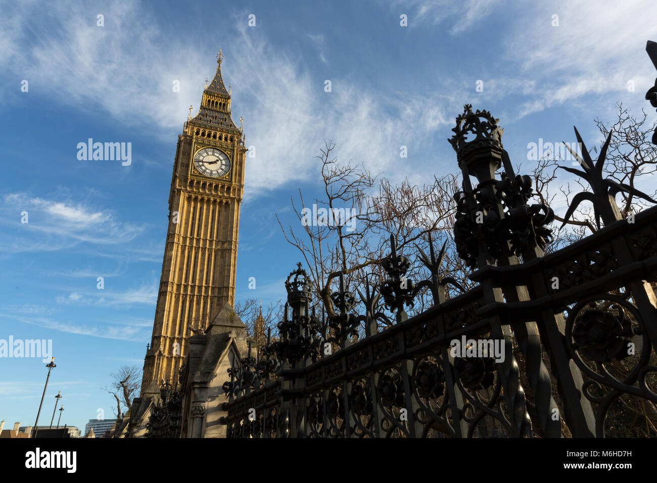 Big Ben and Palace of Westminster gate against blue sky - London ...