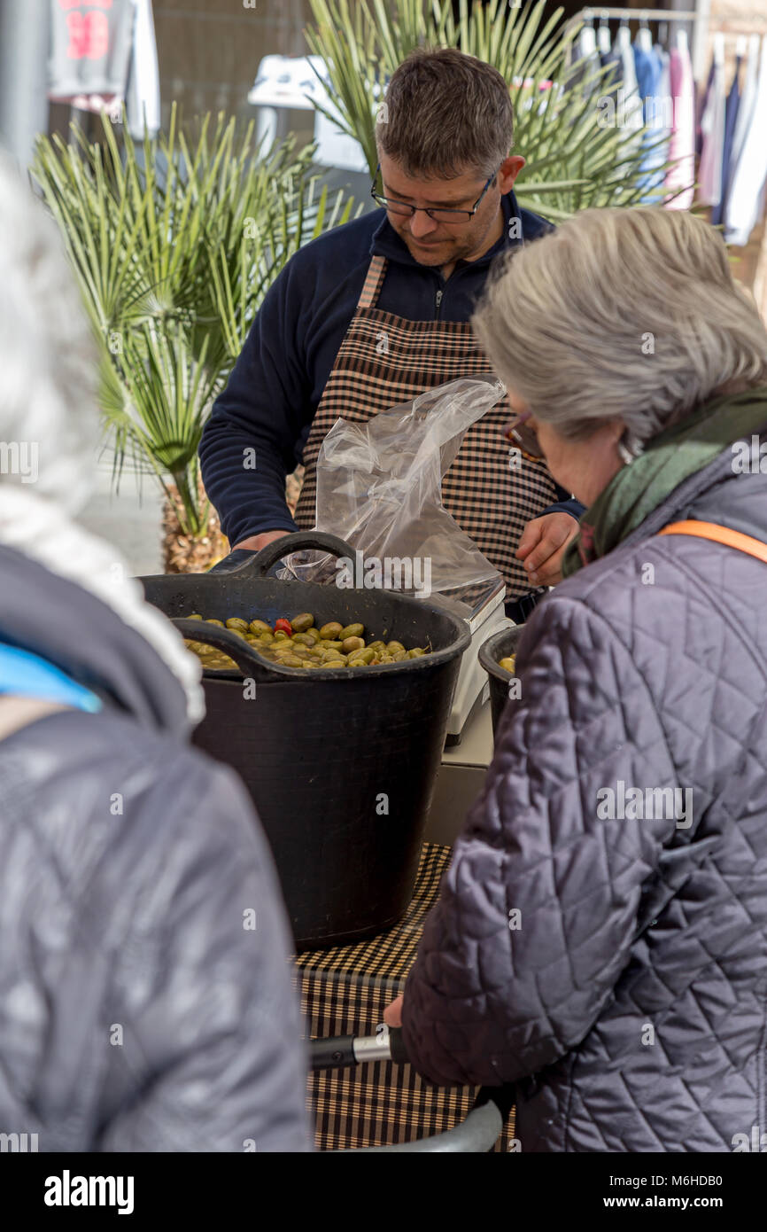 Green olive on the market in the street in town Palamos Stock Photo - Alamy