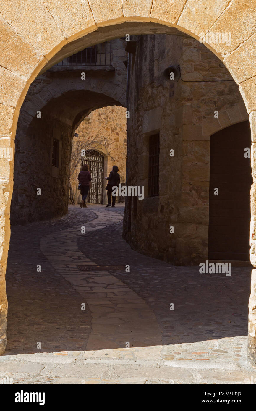 Beautiful old stone arcs in Spanish ancient village, Pals, in Costa ...