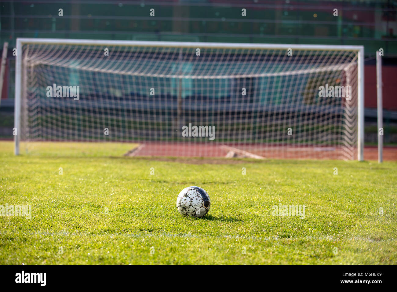 A view of a net on a vacant soccer pitch Stock Photo - Alamy