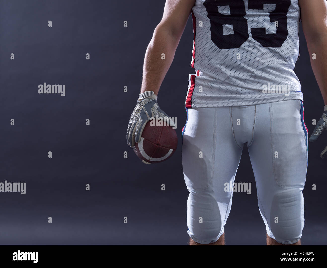 Closeup Portrait of a strong muscular American Football Player isolated ...