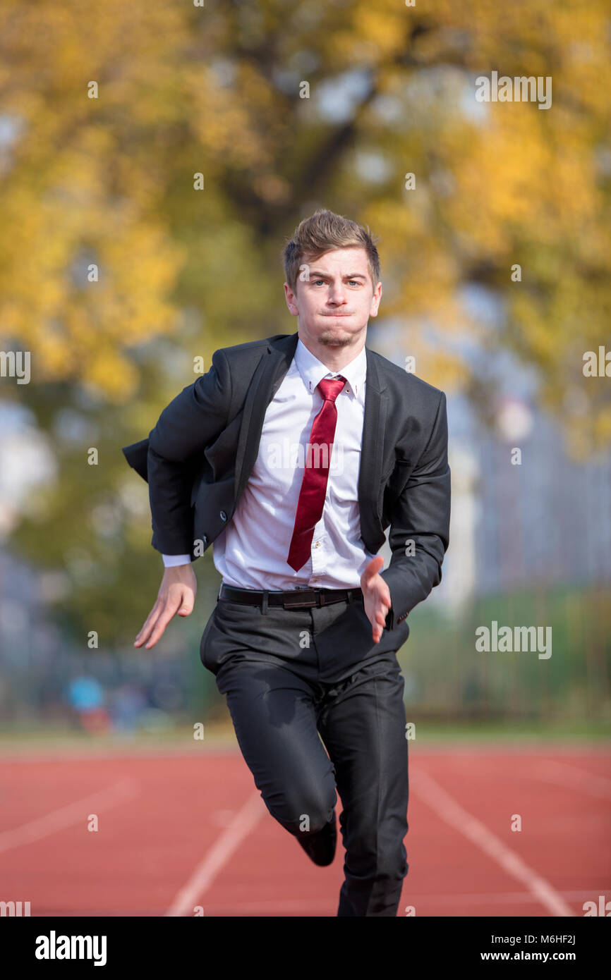 Running in suit hi-res stock photography and images - Alamy