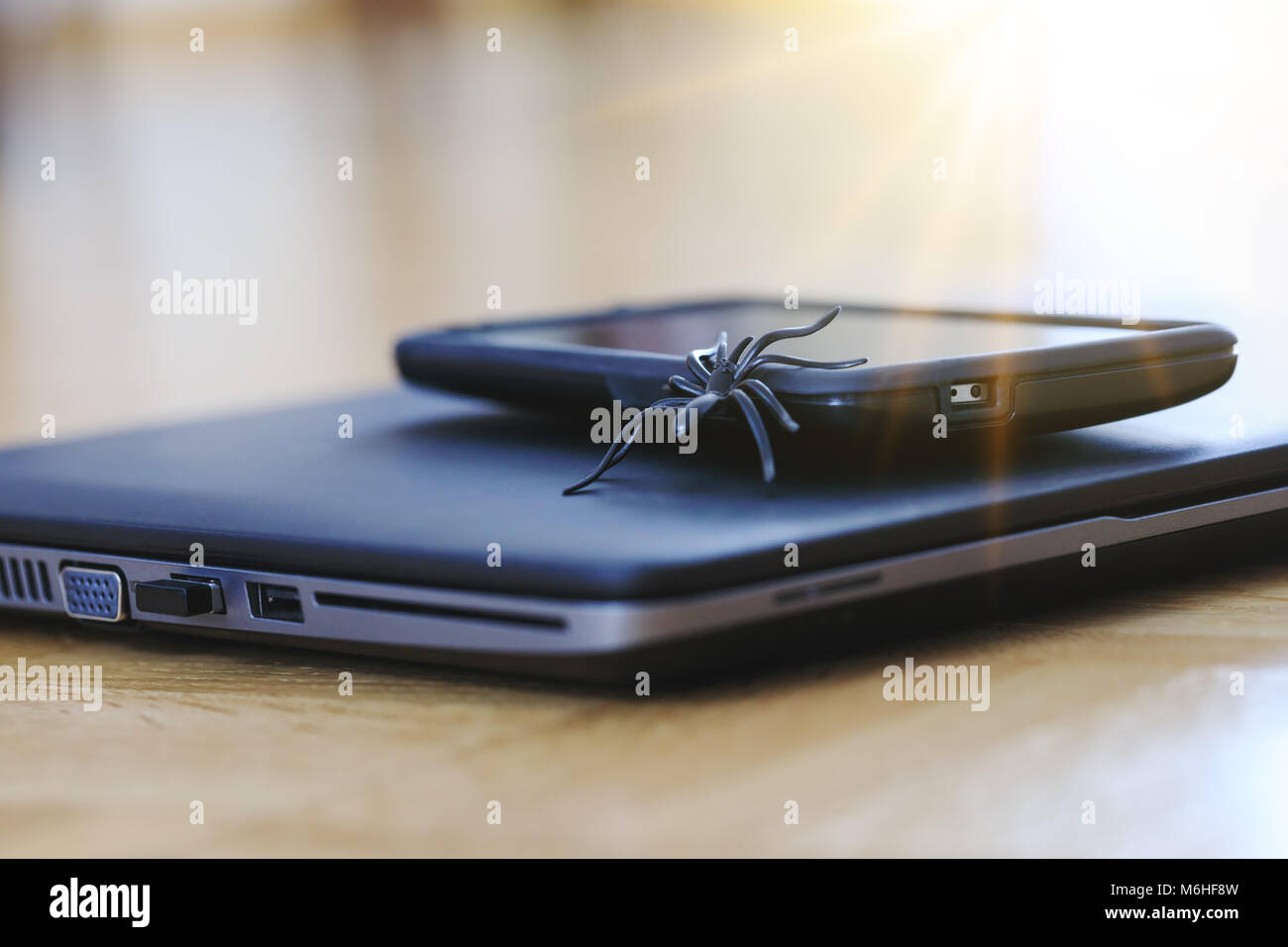 Amazing spider toy in action to escalate a cellphone placed on portable ...