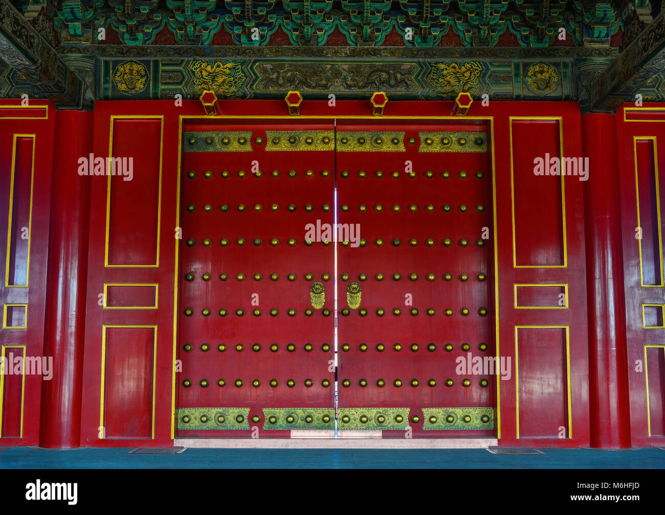 Red wooden door with tile trim at the Forbidden City in Beijing, China ...