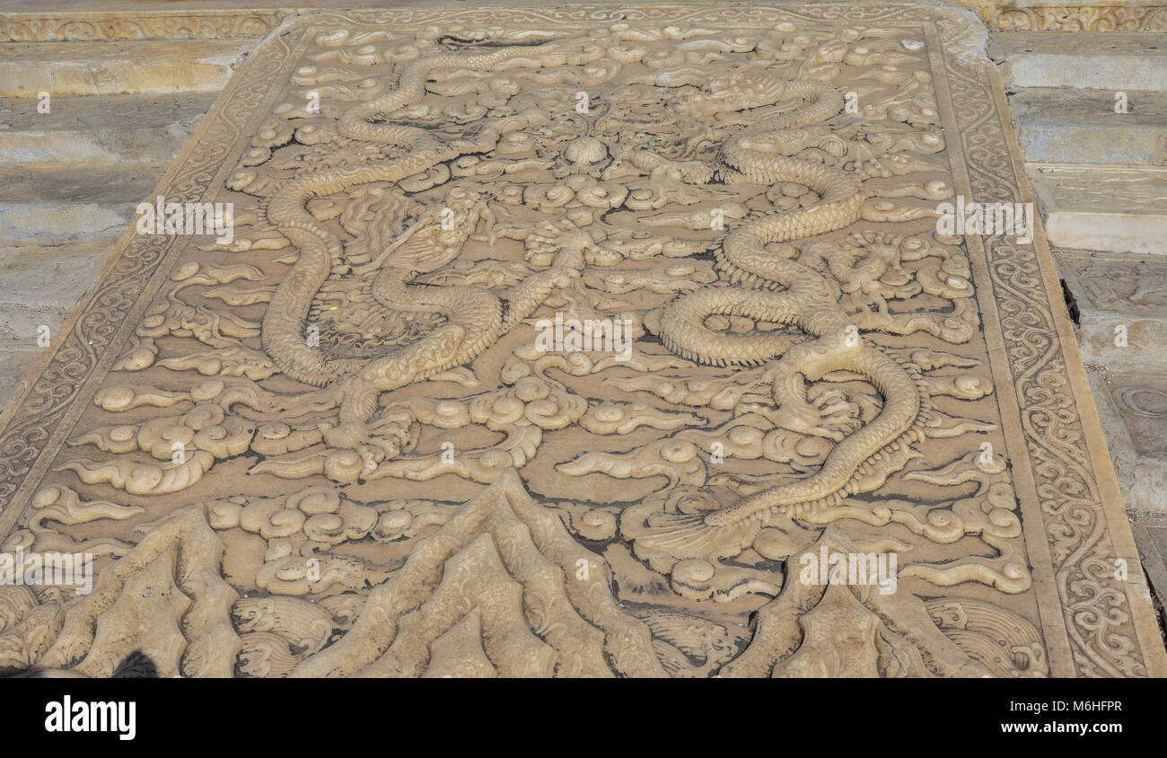 A single marble slab sculptured with dragon and phoenix motifs Stock ...