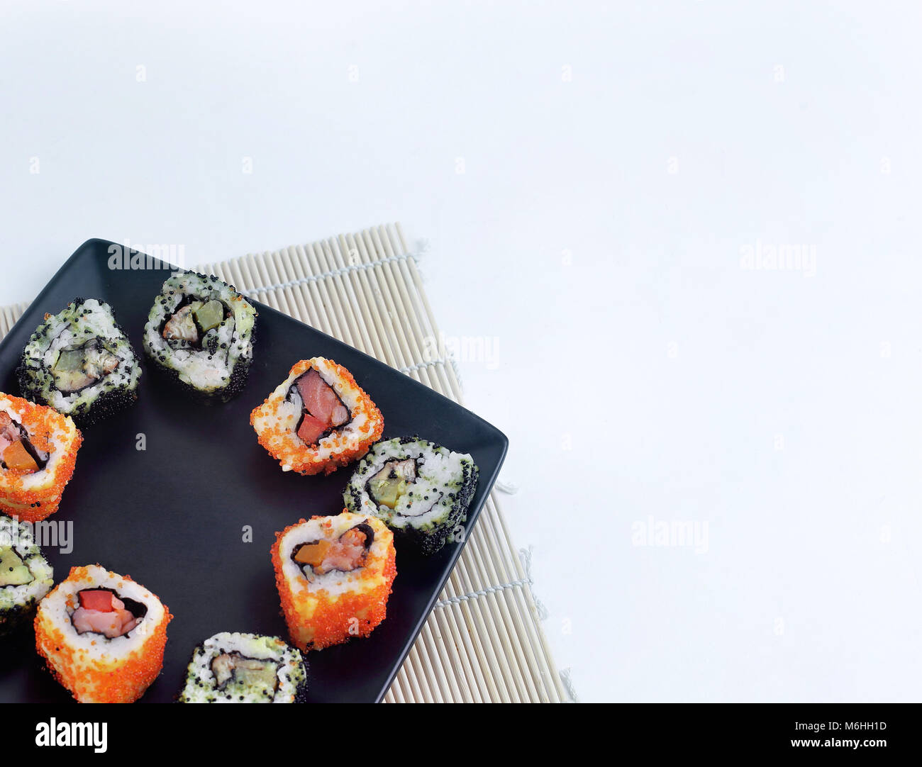 different types of Maki sushi on a black plate Stock Photo - Alamy