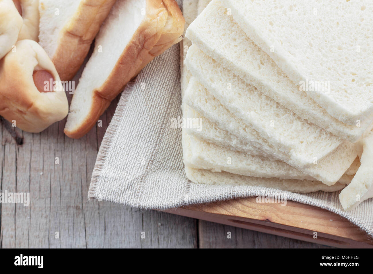 Sliced bread and lined on wooden floor Stock Photo - Alamy