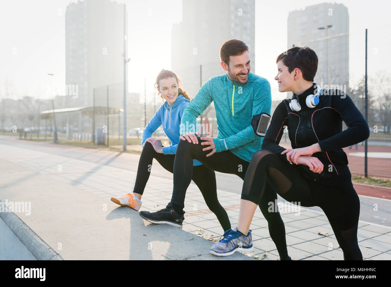 Friends fitness training together outdoors living active healthy Stock ...