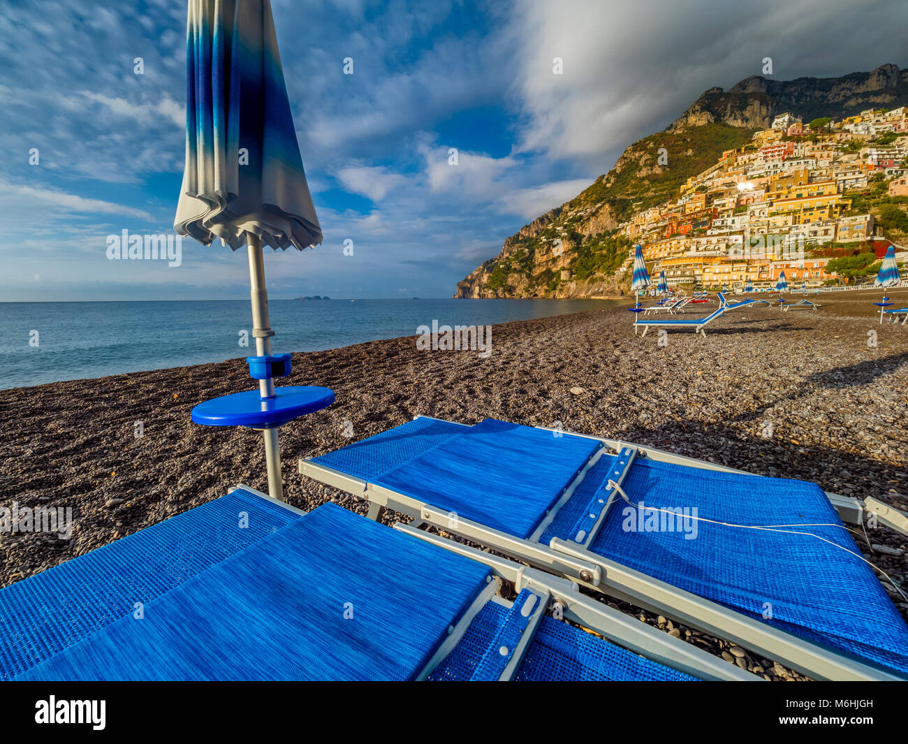 Beach lounge chairs in the town of Positano on Amalfi coast, Italy ...
