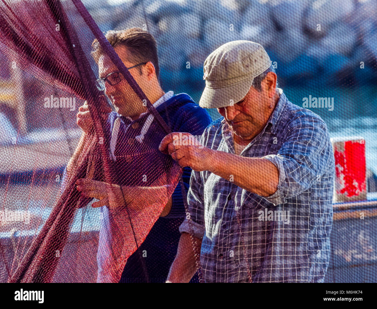 Reeling in fishing nets on Procida Island, Italy Stock Photo - Alamy