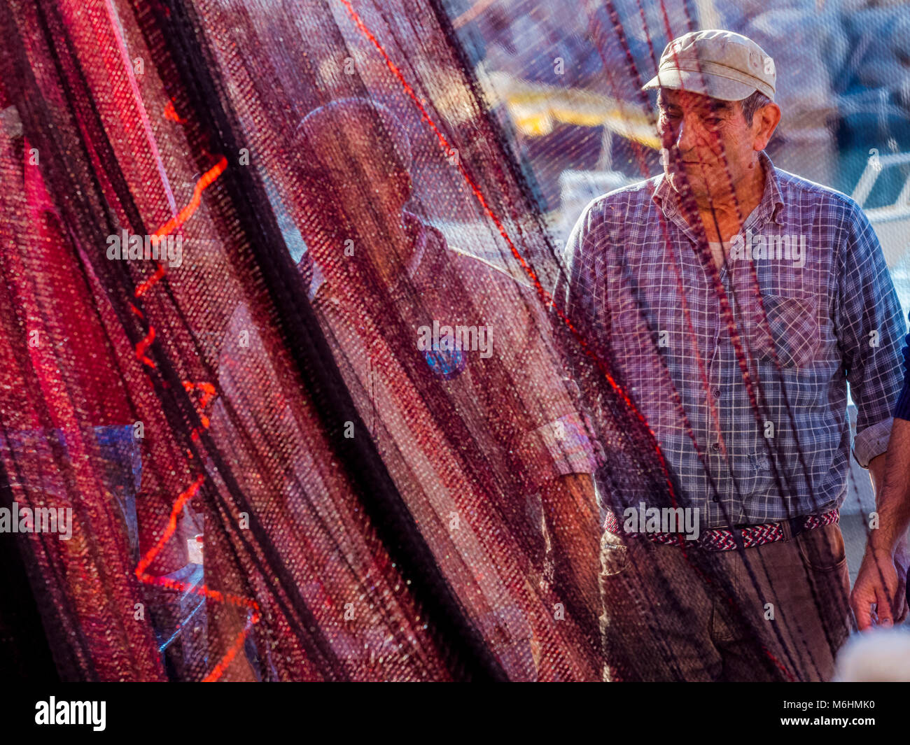 Reeling in fishing nets on Procida Island, Italy Stock Photo - Alamy