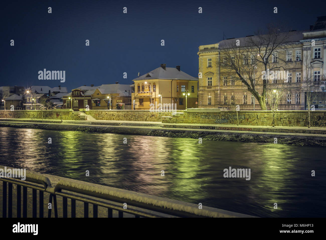 Cityscape of Nis and Nisava river in a winter nigh, architecture and ...