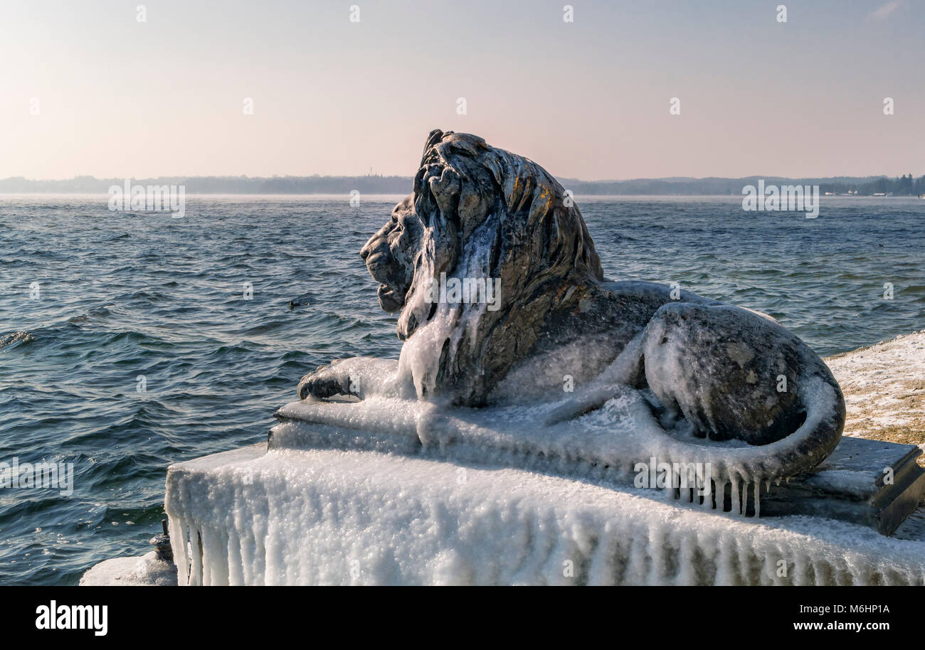 Ice-covered Bavarian Lion on a frosty winter day in Tutzing on Lake ...