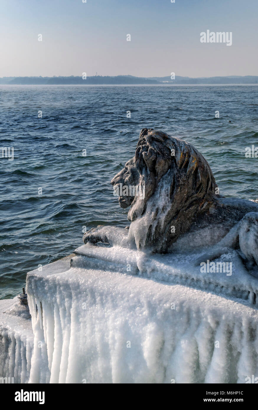Ice-covered Bavarian Lion on a frosty winter day in Tutzing on Lake ...