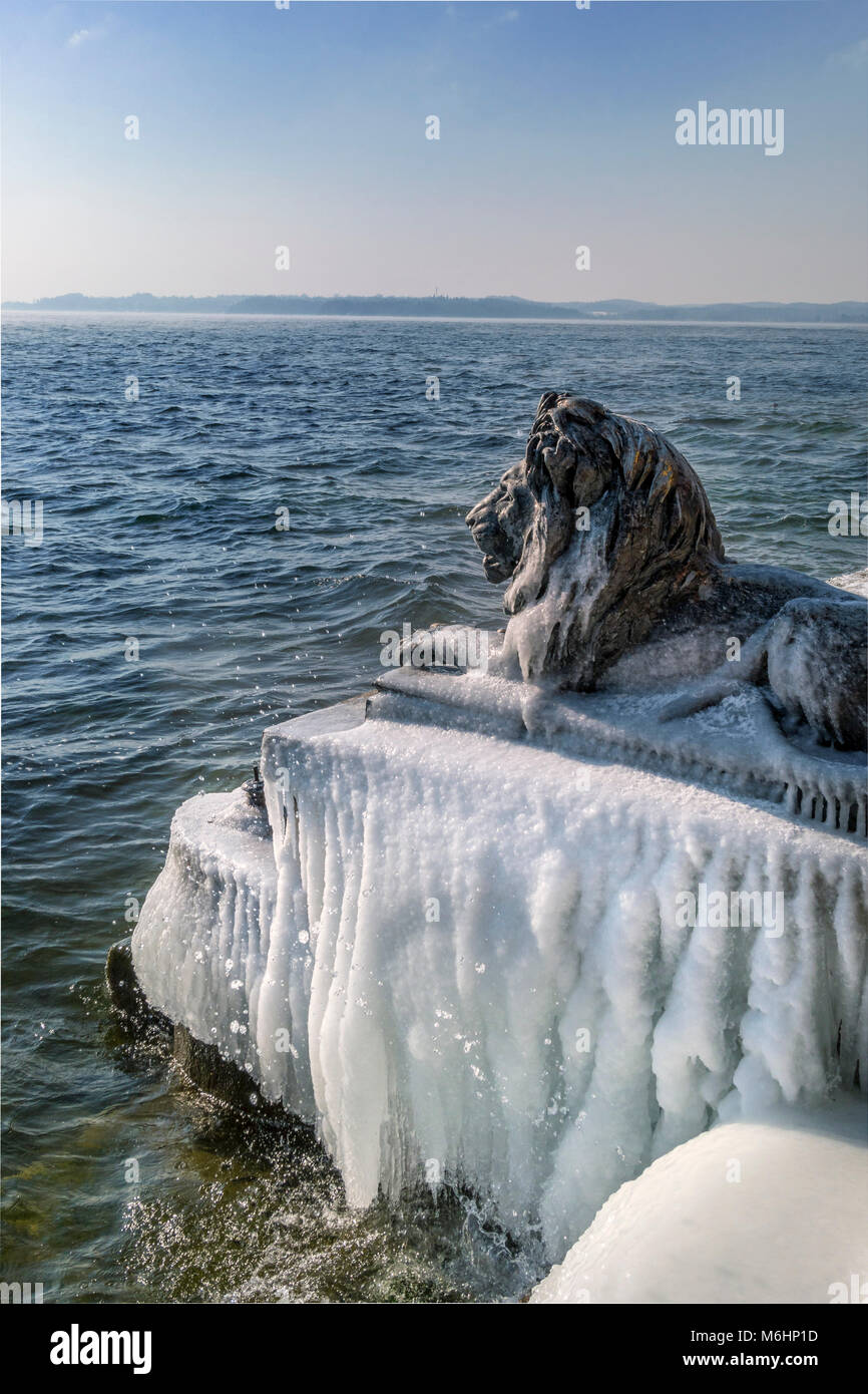Ice-covered Bavarian Lion on a frosty winter day in Tutzing on Lake ...