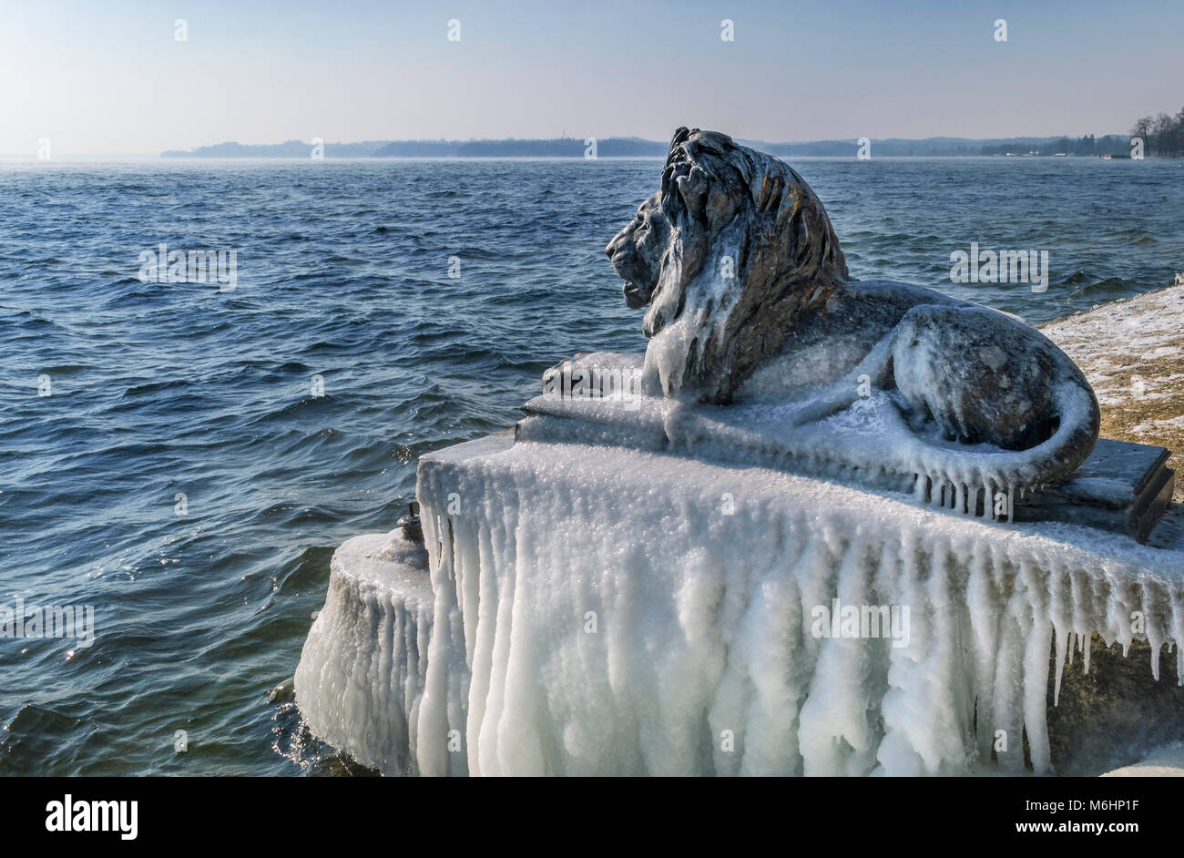 Ice-covered Bavarian Lion on a frosty winter day in Tutzing on Lake ...