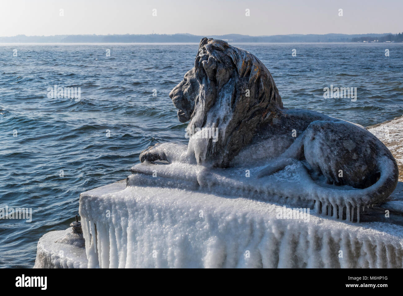 Ice-covered Bavarian Lion on a frosty winter day in Tutzing on Lake ...