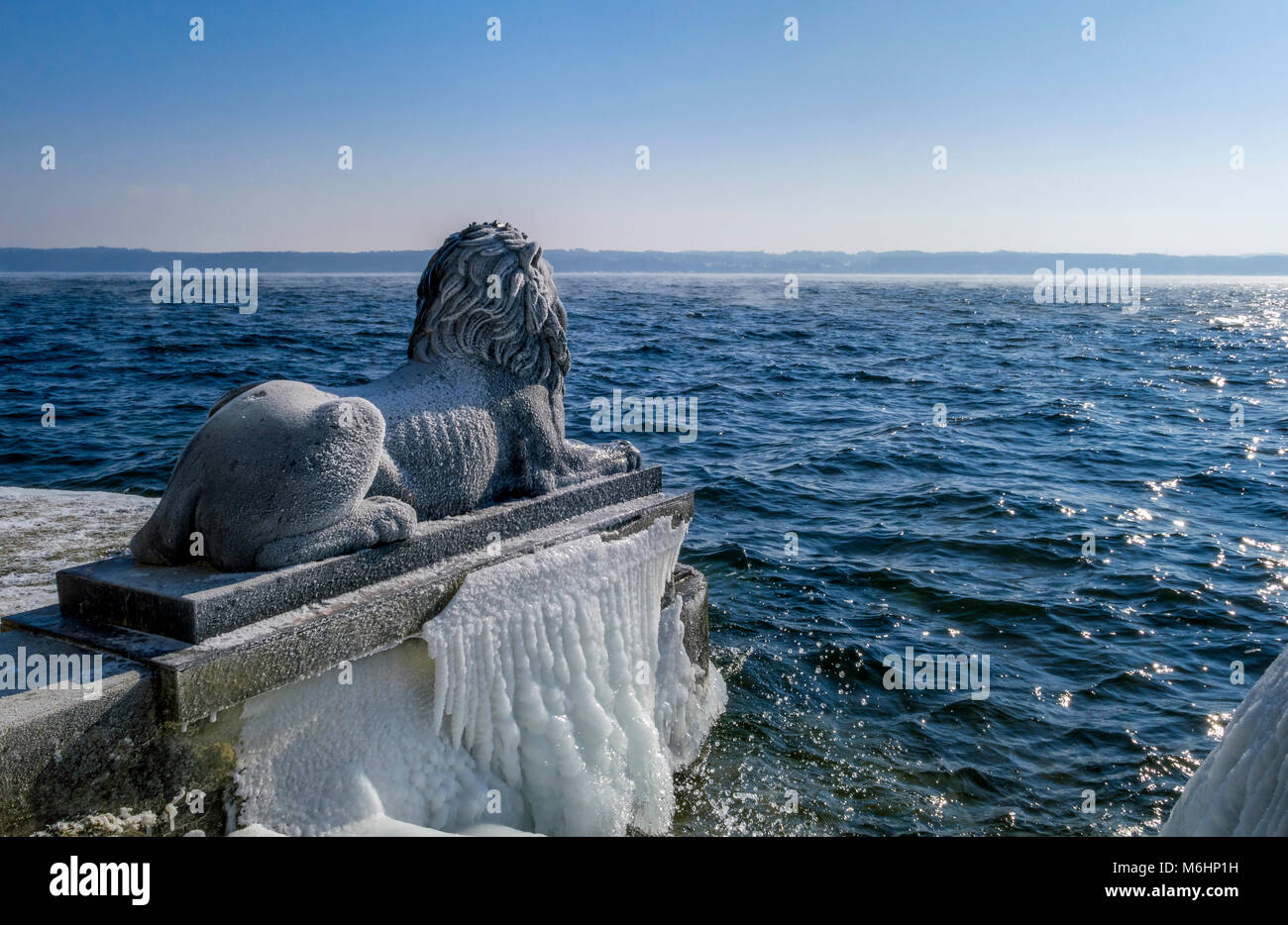 Ice-covered Bavarian Lion on a frosty winter day in Tutzing on Lake ...