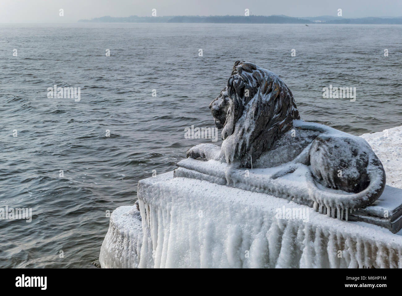 Ice-covered Bavarian Lion on a frosty winter day in Tutzing on Lake ...