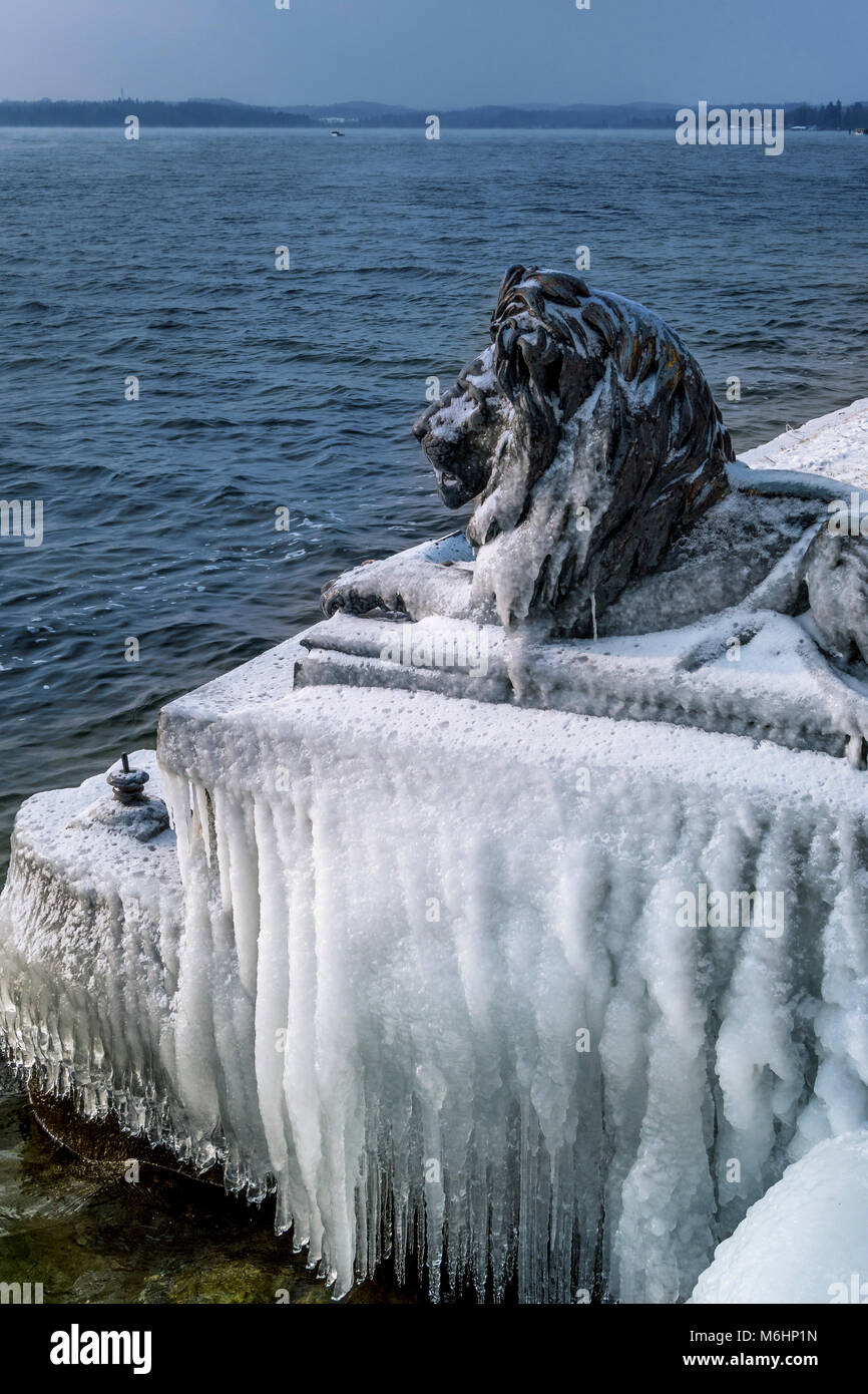 Ice-covered Bavarian Lion on a frosty winter day in Tutzing on Lake ...