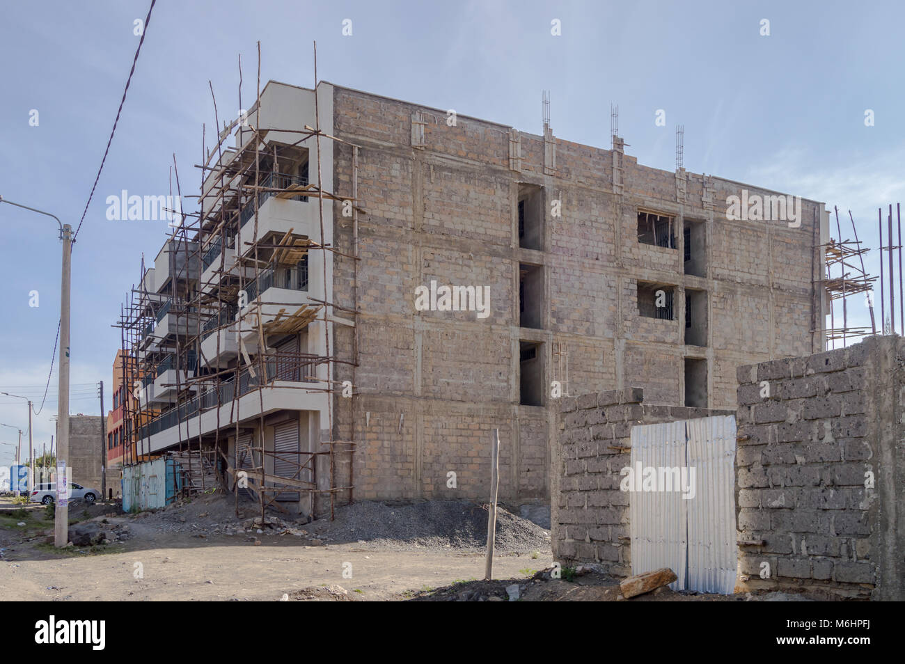 Building under construction with a wooden scaffolding in the city of ...
