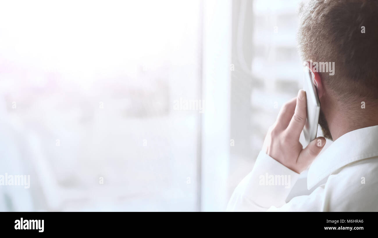 Young businessman calling partner to appoint meeting, successful career ...