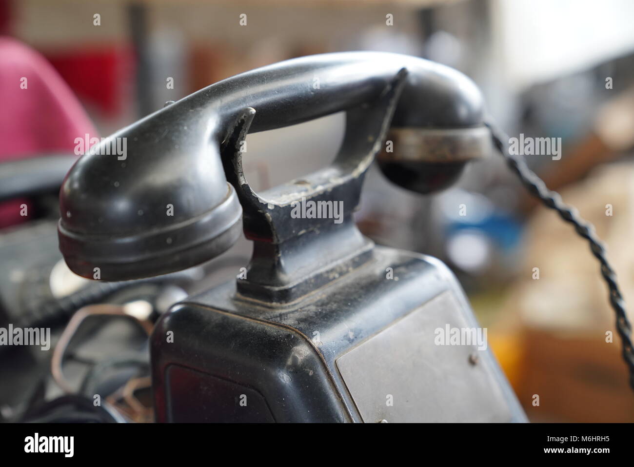 Old vintage antique black phone with rotary disc back Stock Photo - Alamy