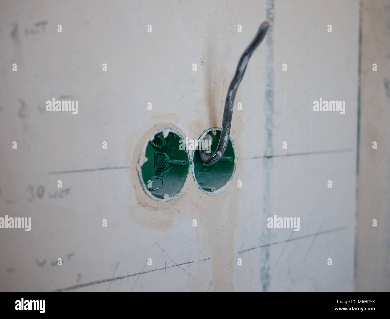 Double power socket hole in concrete wall Stock Photo - Alamy