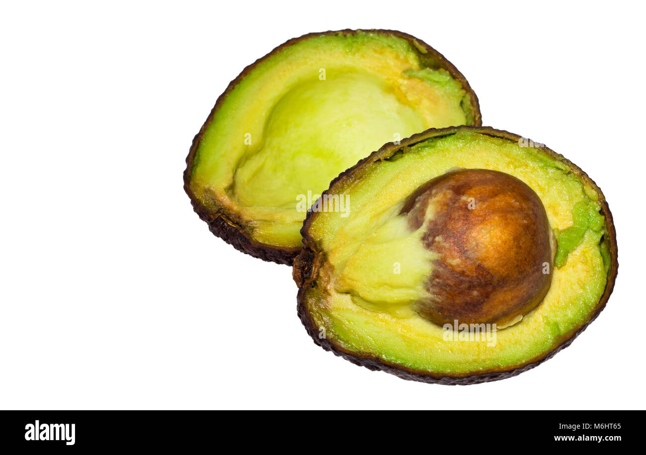 Two slices of avocado isolated on the white background. One slice with ...