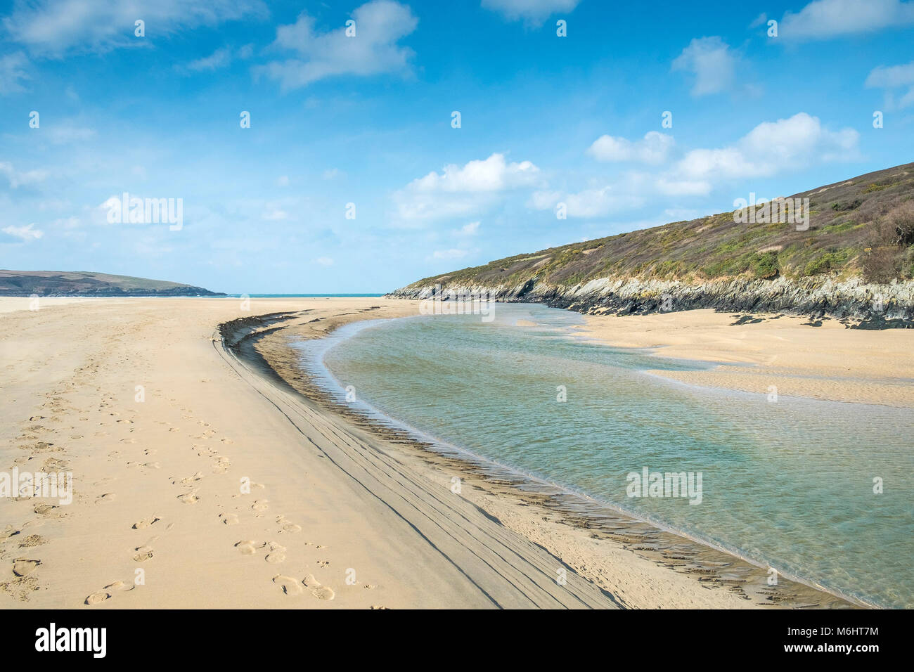 The Gannel River flowing across the beach at Crantock in Newquay ...