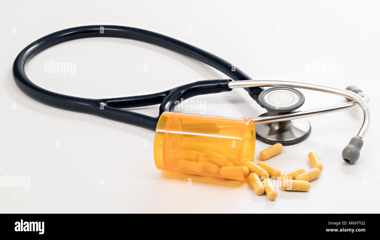 Medical tool stethoscope with a bottle of medication Stock Photo - Alamy