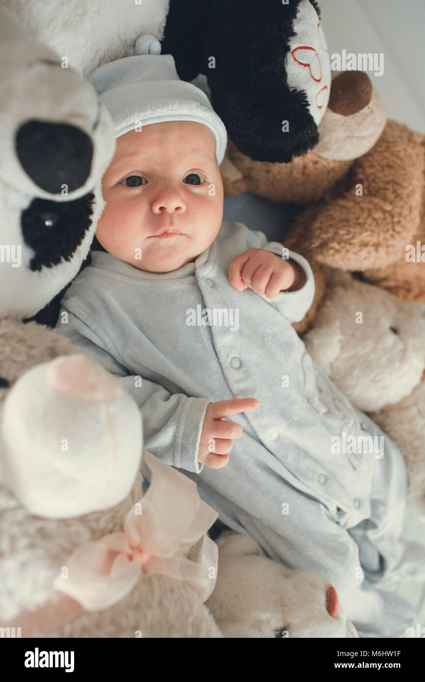 Little cute newborn baby with teddy bears Stock Photo - Alamy