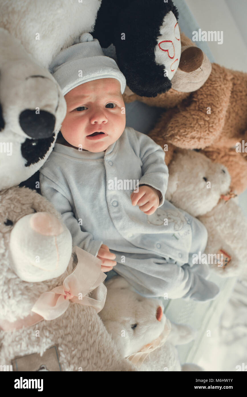 Little cute newborn baby with teddy bears Stock Photo - Alamy