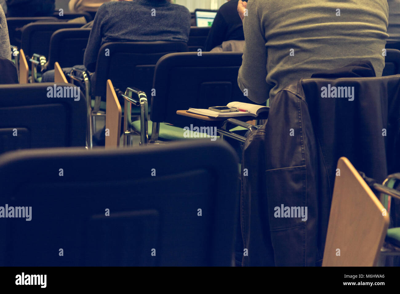 Smart phone on classroom table Stock Photo - Alamy