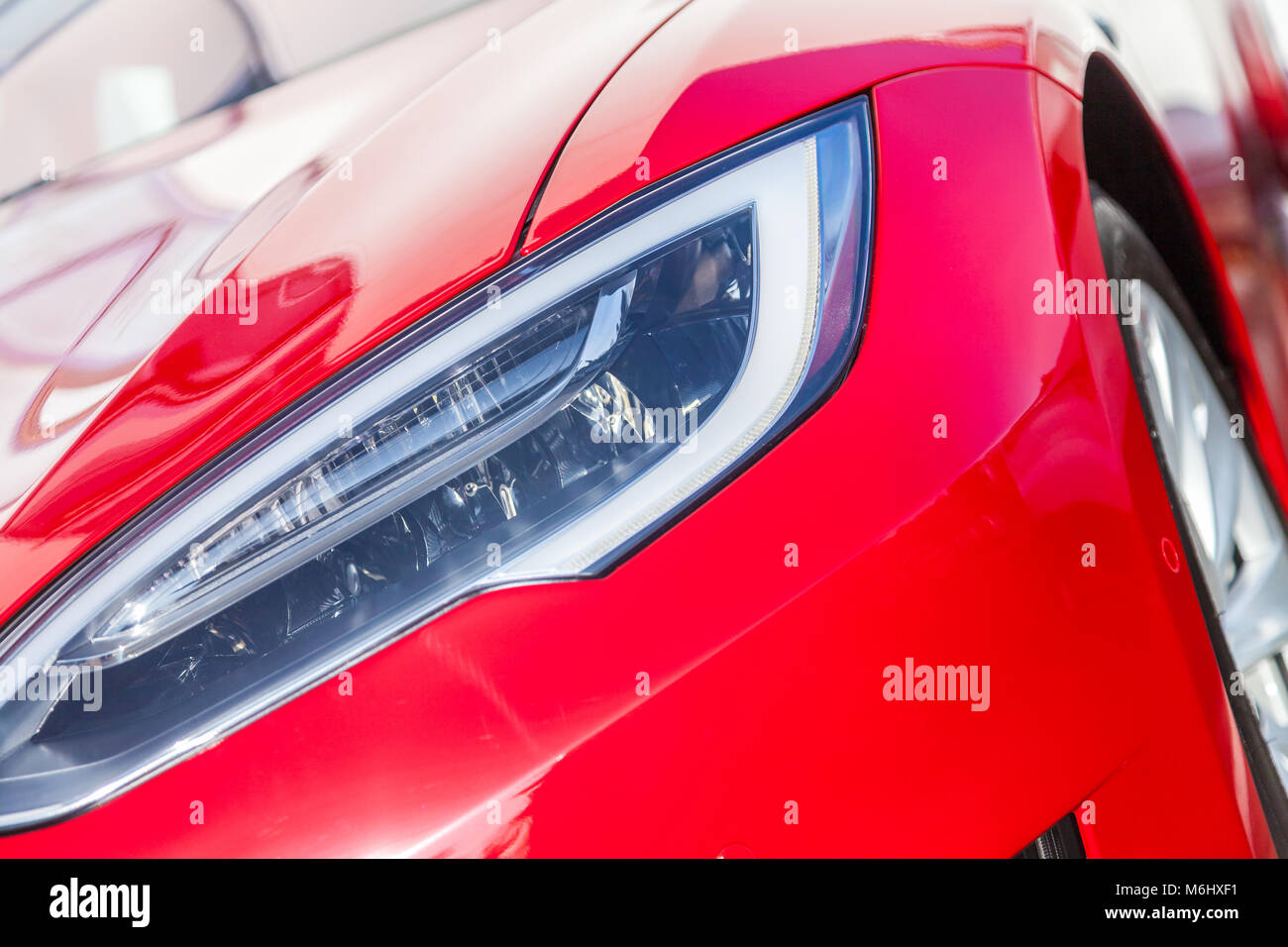 shiny headlights on a red sports car Stock Photo - Alamy