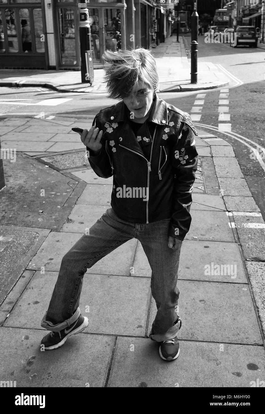 Woman Strutting a pose outside the Prince Edward Theatre, Soho, London ...